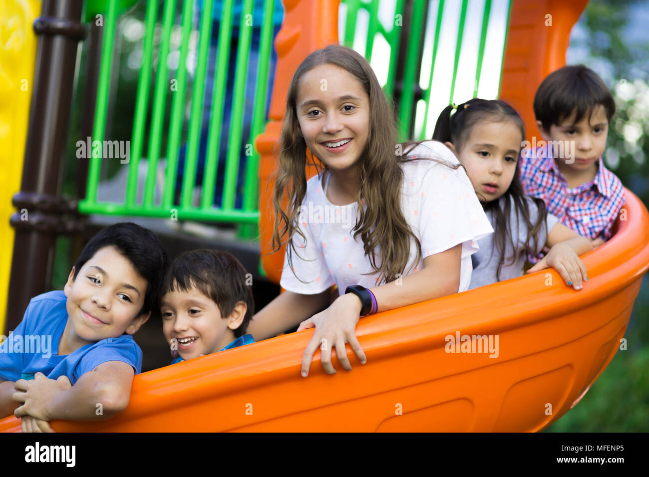 Happy children having fun on the grass in the park Stock Photo - Alamy