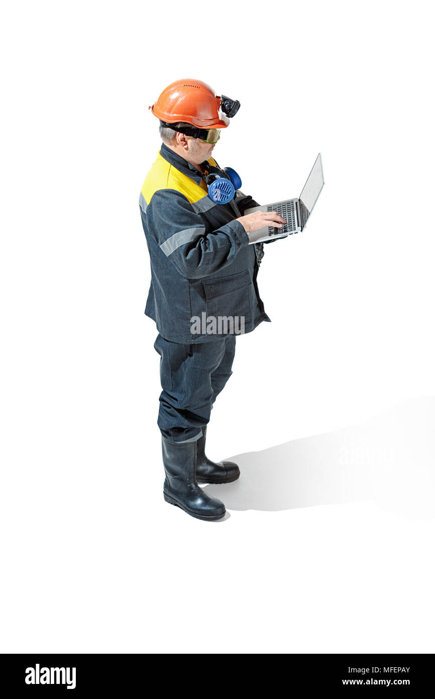 The studio shot of senior bearded serious male miner in professional ...