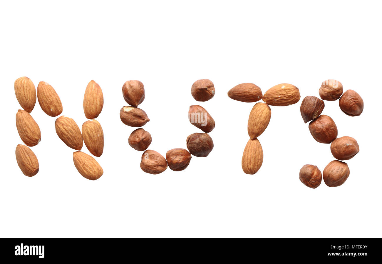 Word NUTS made from cashew and hazelnut on white background. Isolated ...