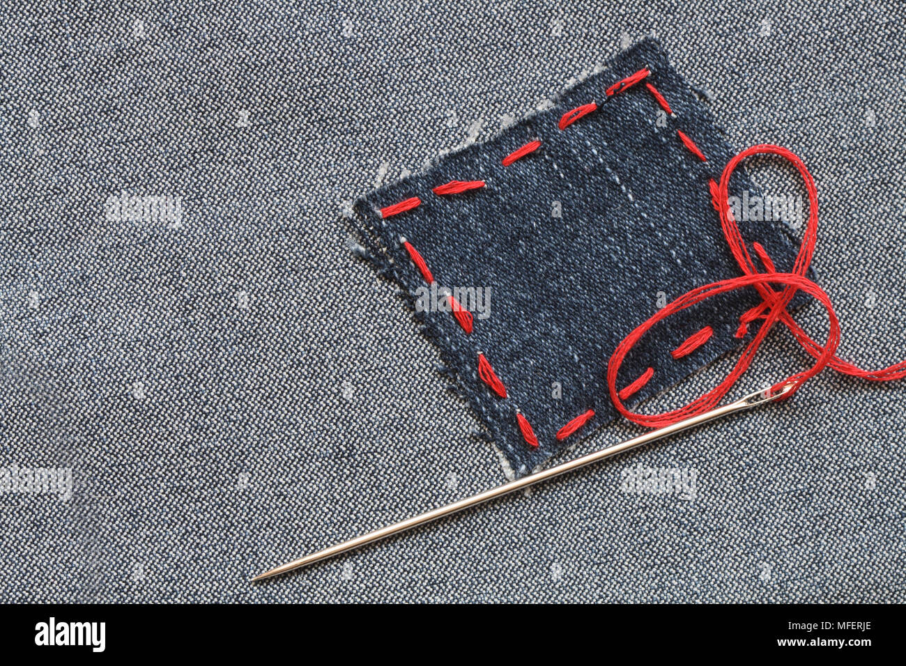 Needle and thread patch hi-res stock photography and images - Alamy
