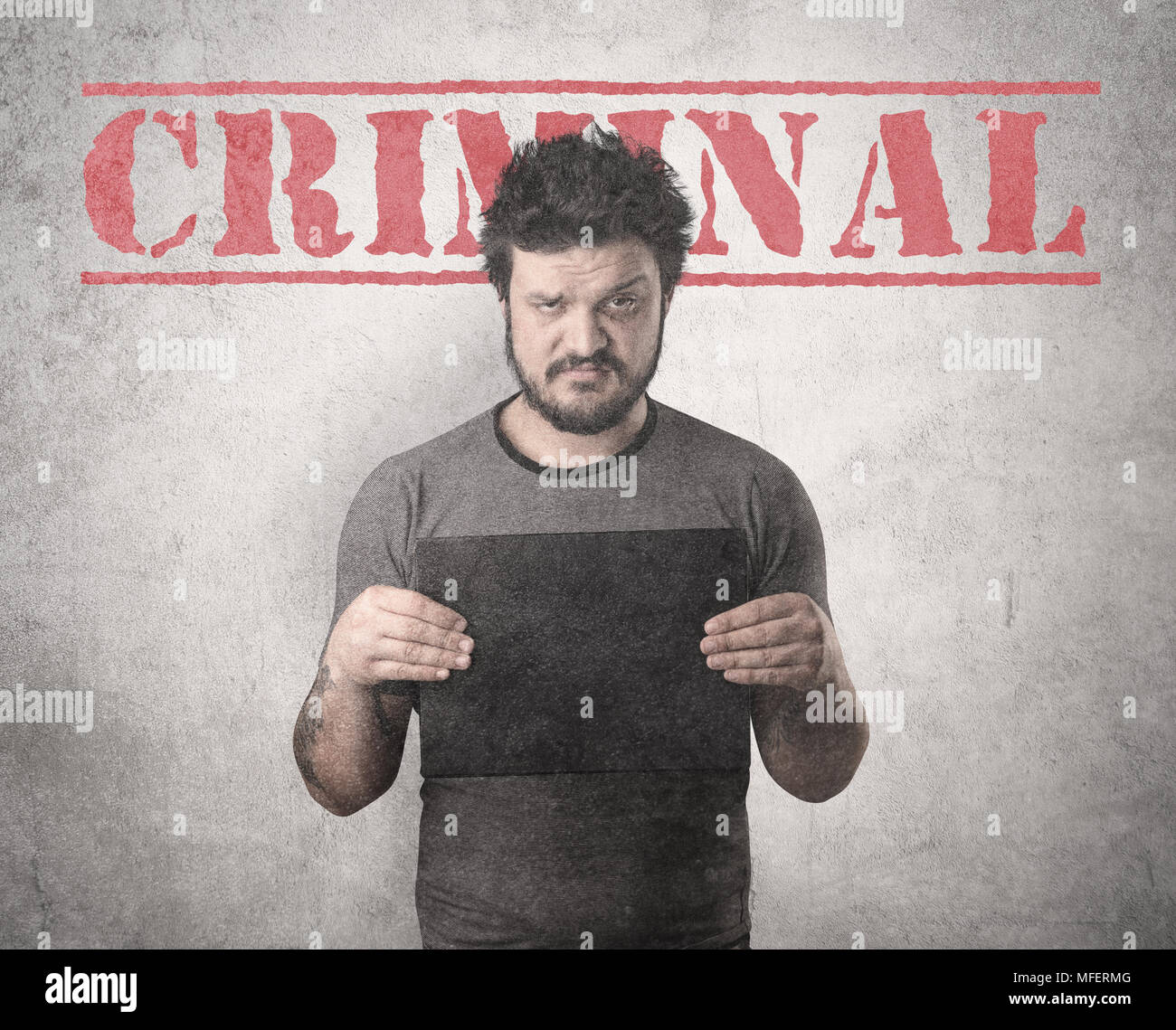 Caught gangster with criminal background Stock Photo - Alamy