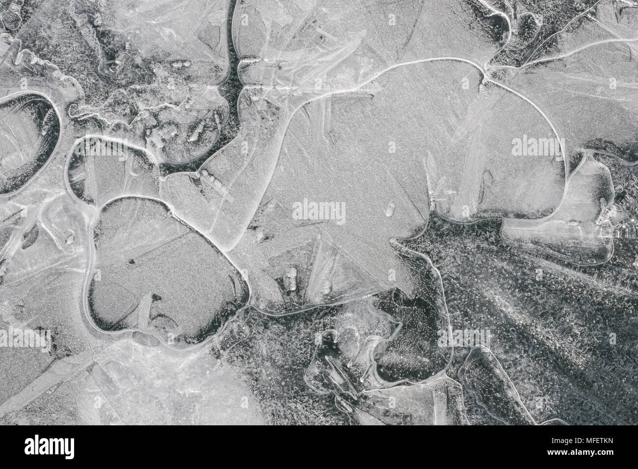 Ice pattern on frozen lake; Alberta, Canada Stock Photo - Alamy