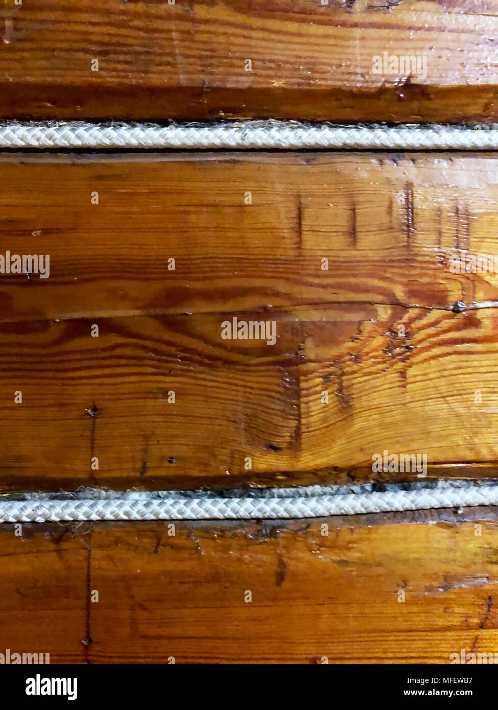 Wooden background of boards with a rope in the seam Stock Photo - Alamy