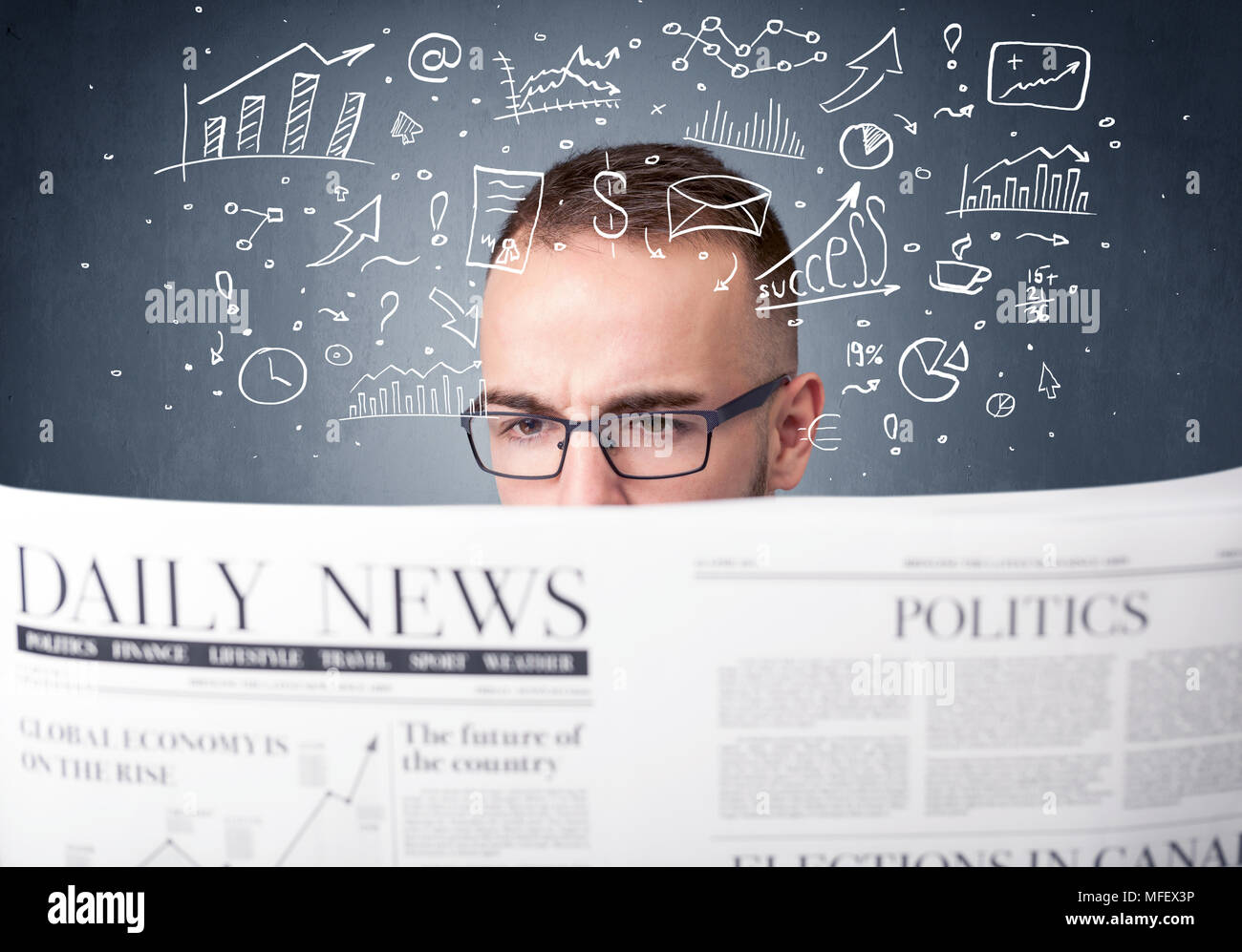 Young smart businessman reading daily newspaper with business plan ...