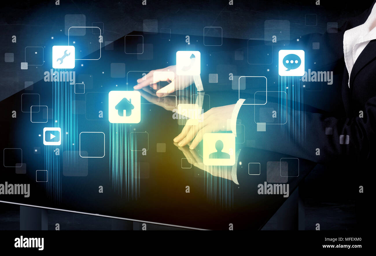 Modern smart table with high tech icons on its interface screen concept ...