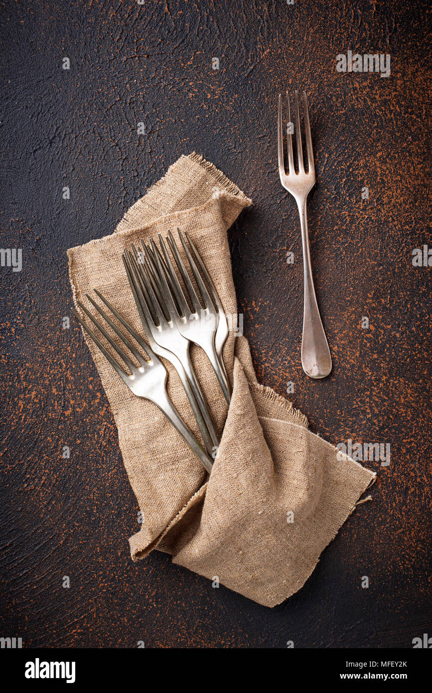 Vintage forks on rusty background Stock Photo - Alamy