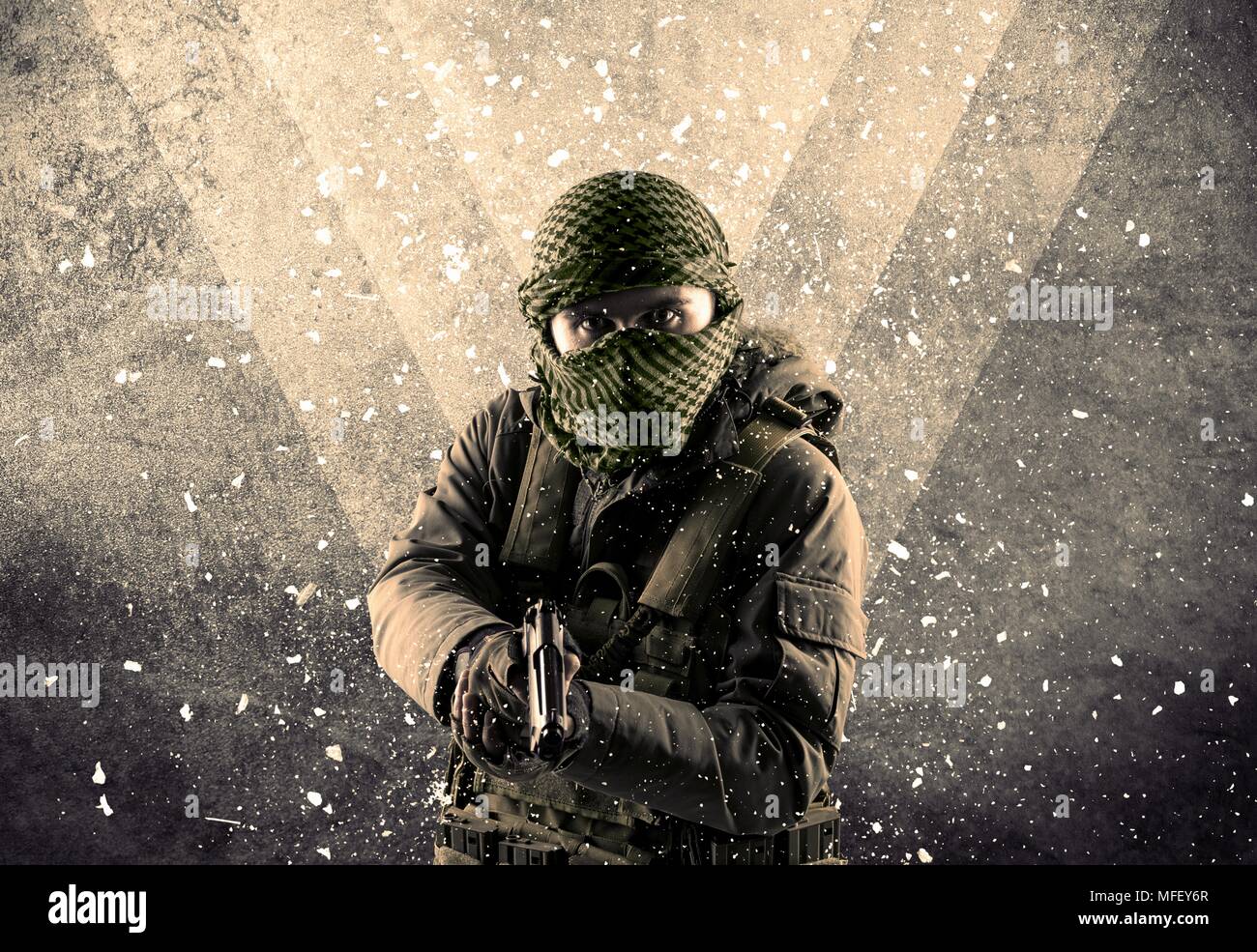 Portrait of a dangerous masked armed soldier with grungy light ...