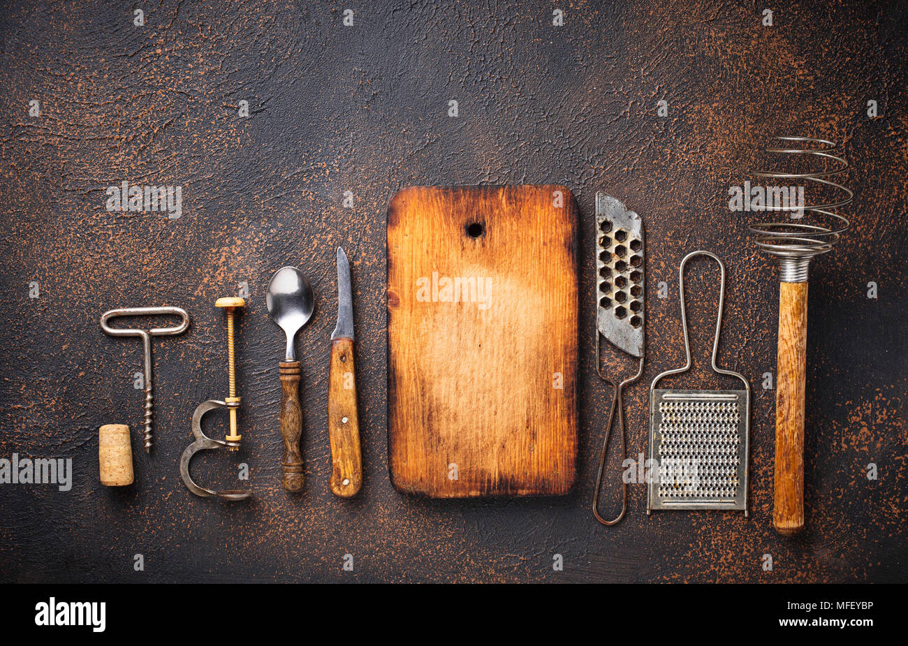 Old vintage kitchen utensils on rusty background Stock Photo - Alamy