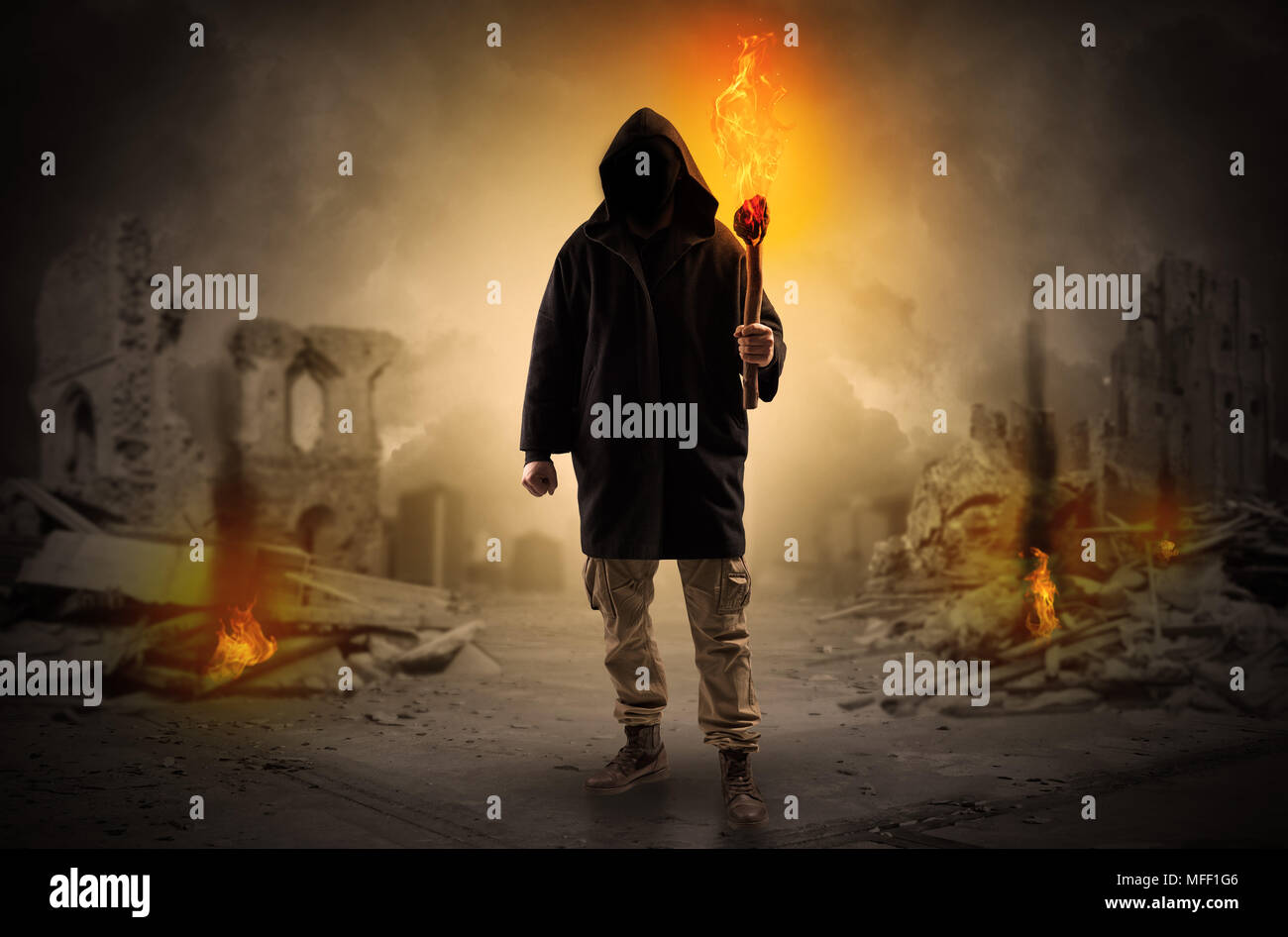 Destroyed place after a catastrophe with man and burning flambeau ...