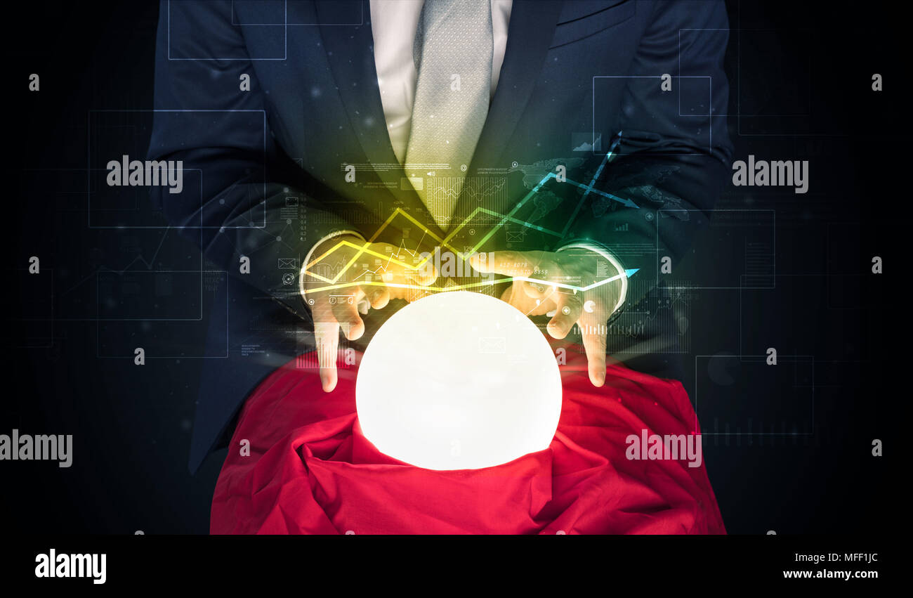 Young businessman making predictions of the future of the stock market ...