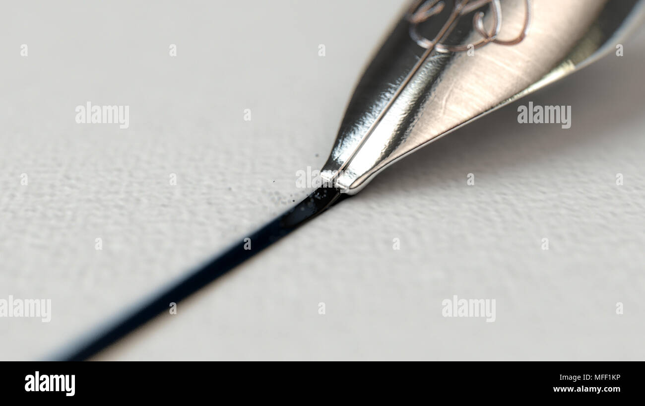 A closeup view of an ornate metal nib of an old fountain pen drawing a ...
