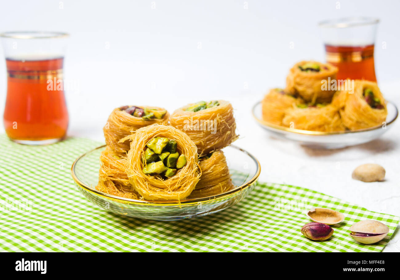 Arabic dessert with pistachio mabroume served with tea Stock Photo - Alamy