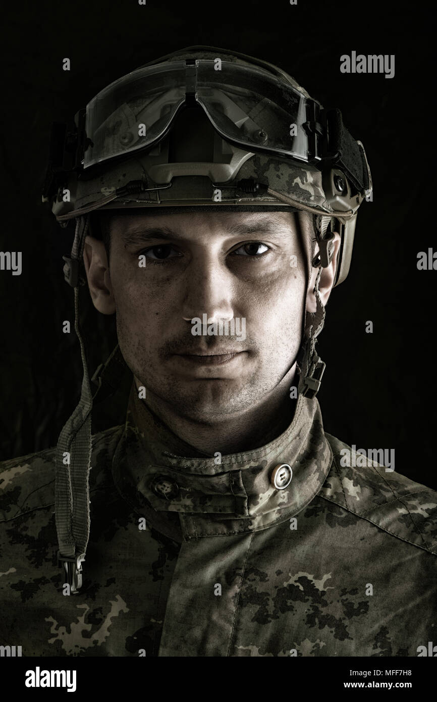 close up portrait of handsome military man. Macro shot on black ...