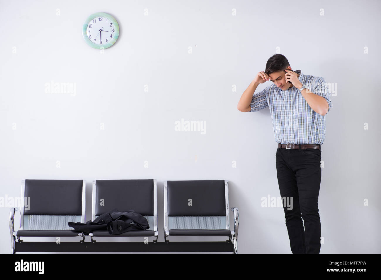 Man nervously impatiently waiting in the lobby Stock Photo - Alamy