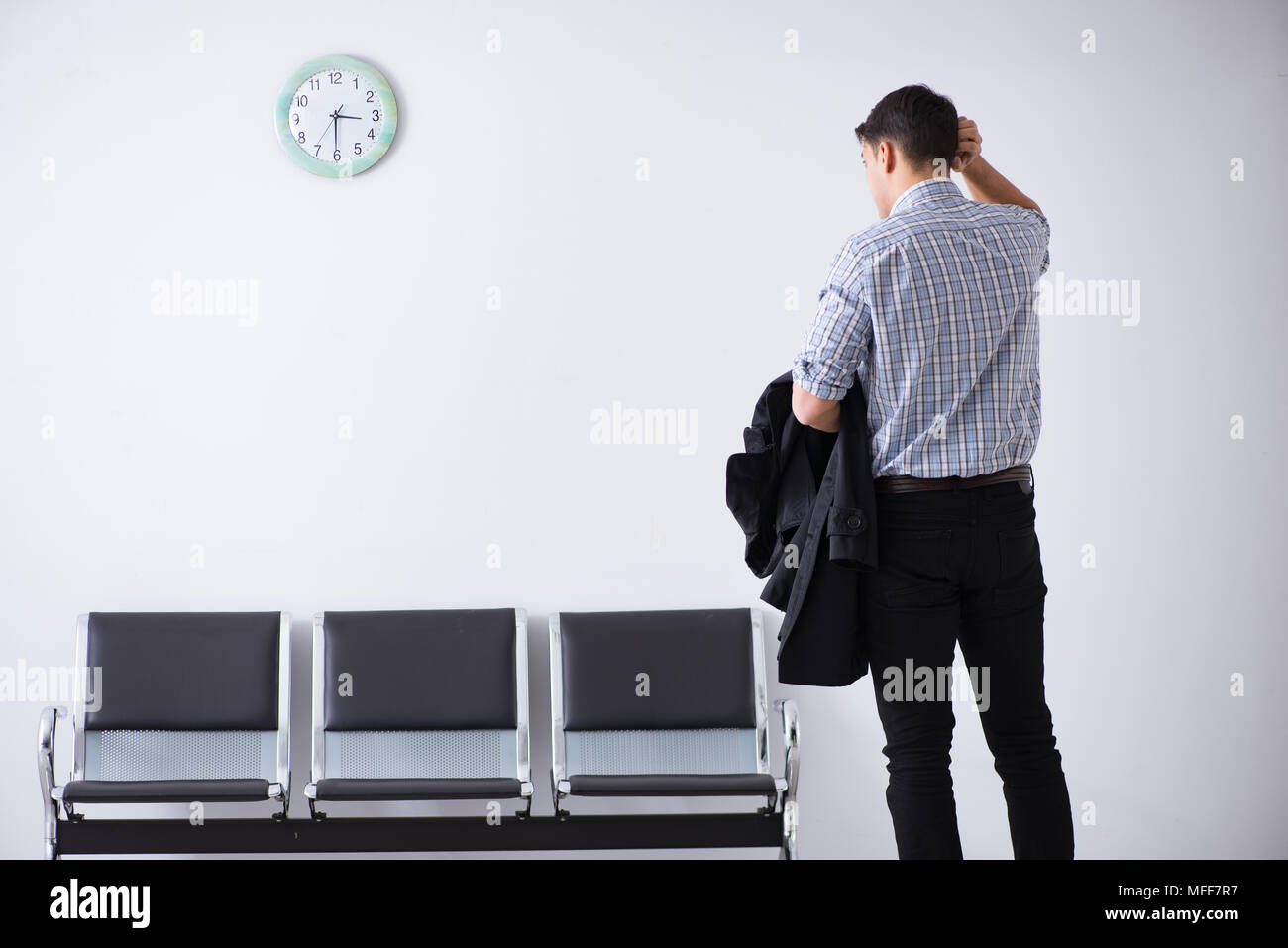 Man nervously impatiently waiting in the lobby Stock Photo - Alamy