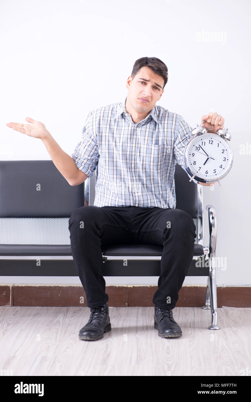 Man nervously impatiently waiting in the lobby Stock Photo - Alamy