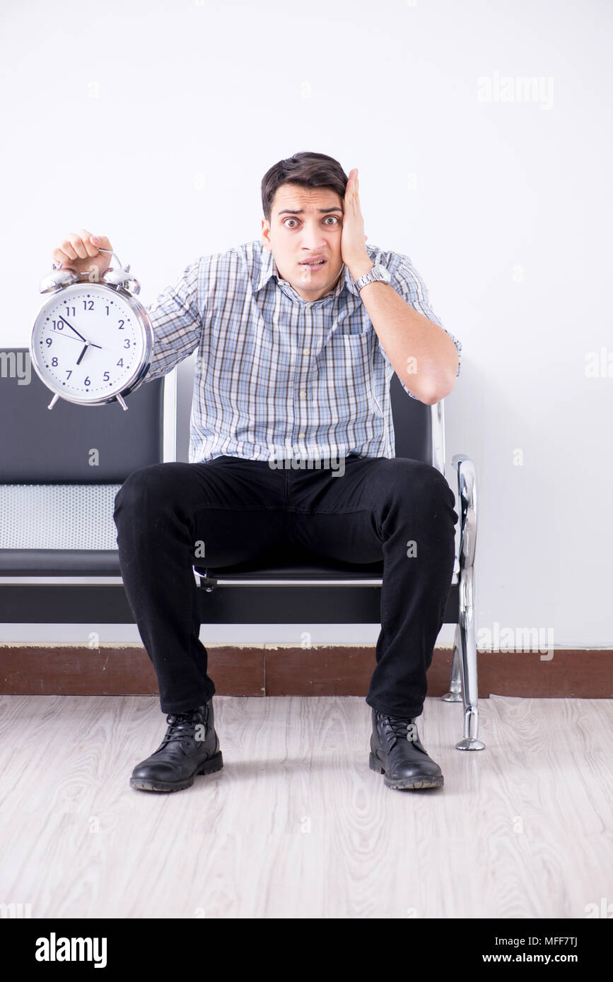 Man nervously impatiently waiting in the lobby Stock Photo - Alamy