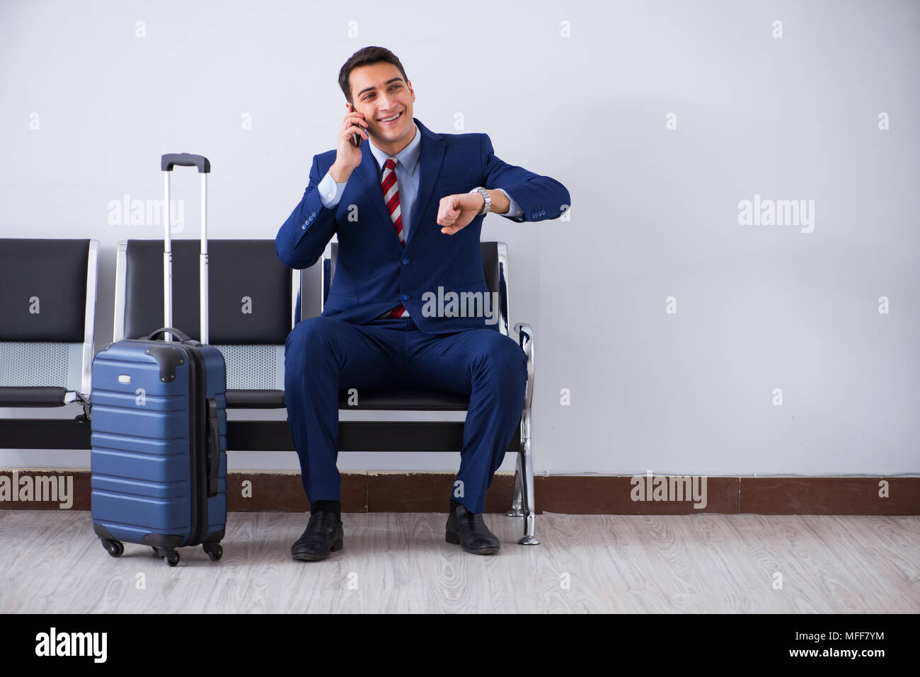 Man wairing to boarding in airport lounge room Stock Photo - Alamy