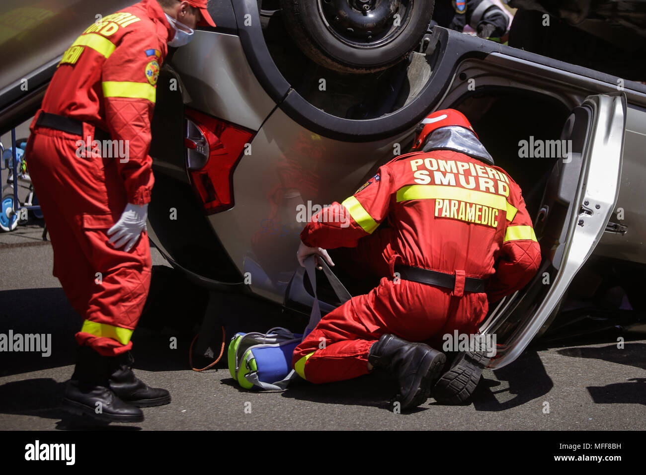 Rescue firefighters and paramedics take part in a vehicle extrication ...