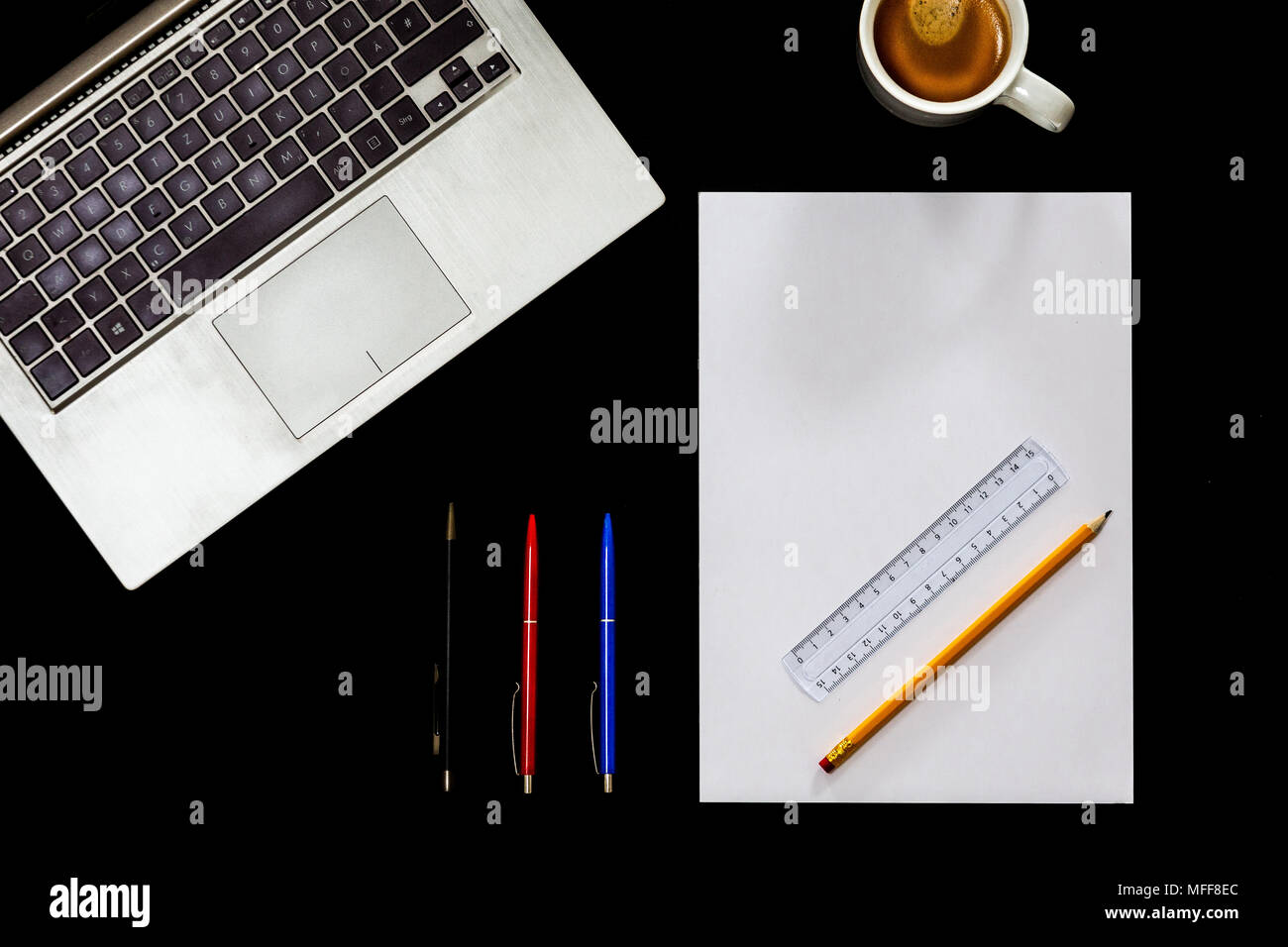 top view of office desk with blank notebook paper pen rope carabiner ...