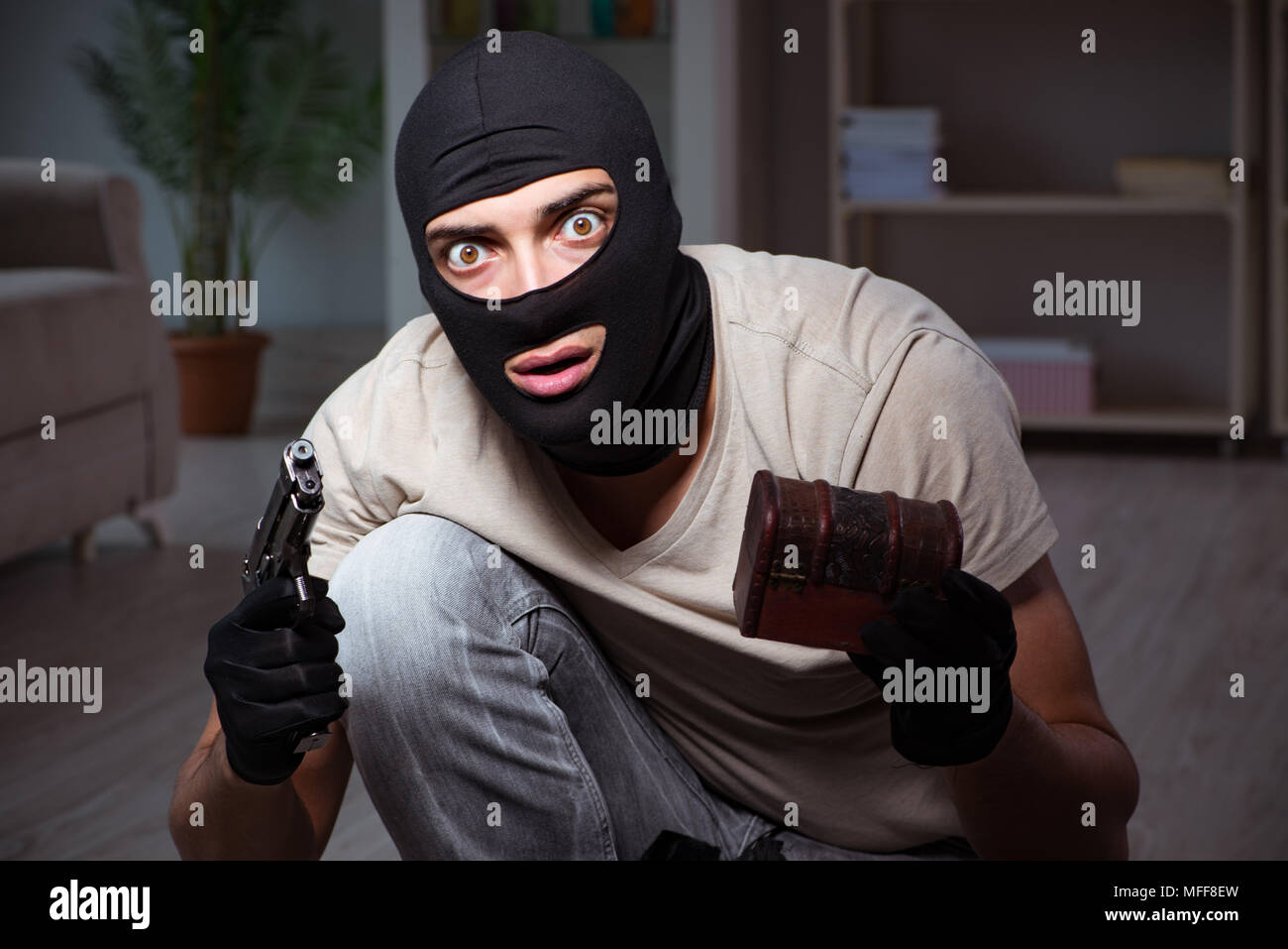 Burglar wearing balaclava mask at crime scene Stock Photo - Alamy