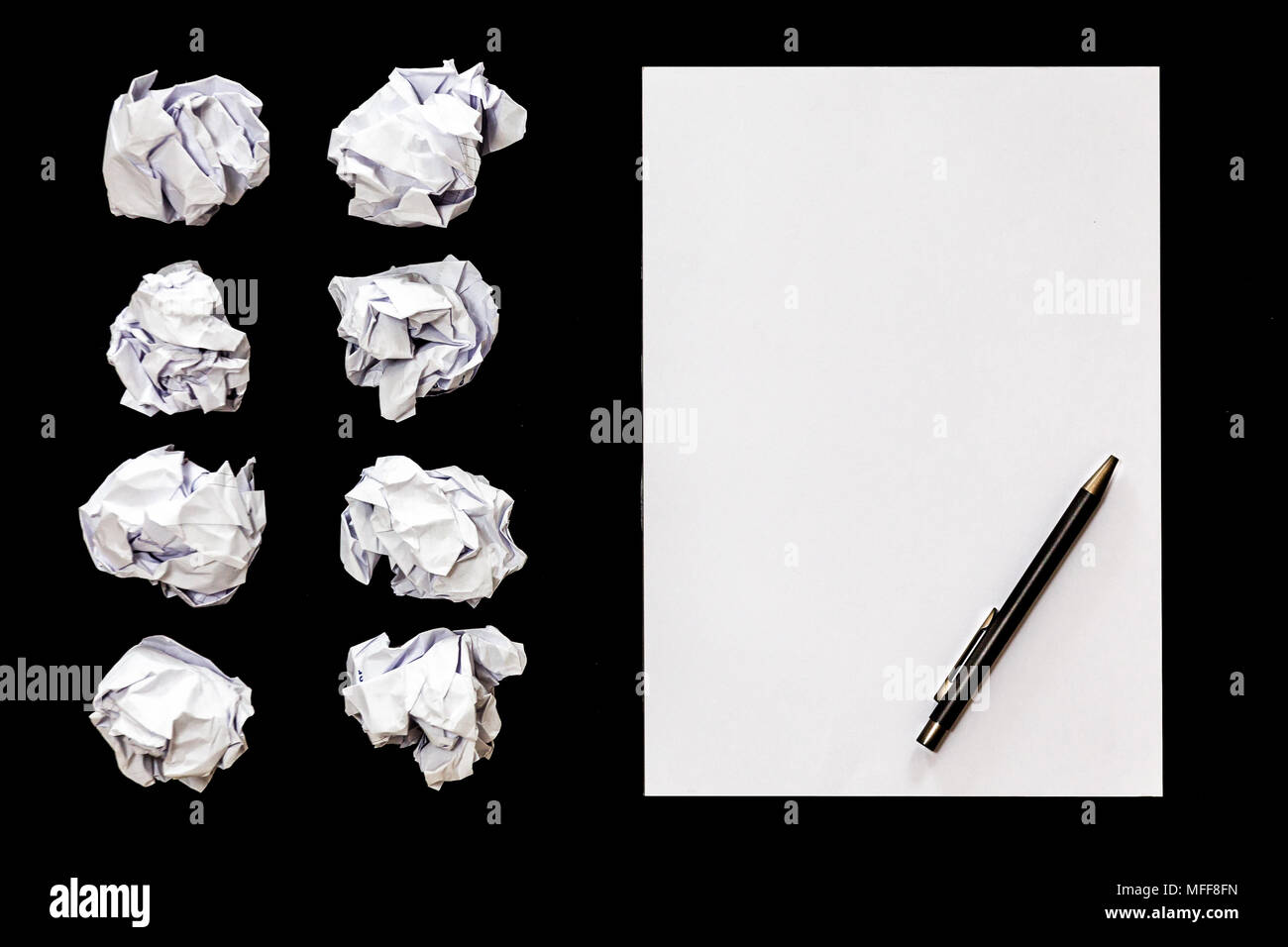 top view of office desk with blank notebook paper pen rope carabiner ...