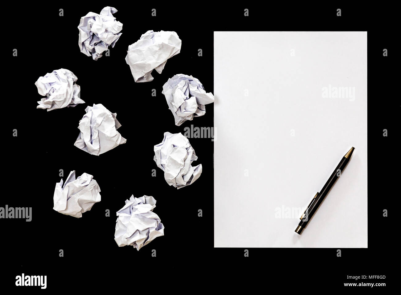 top view of office desk with blank notebook paper pen rope carabiner ...