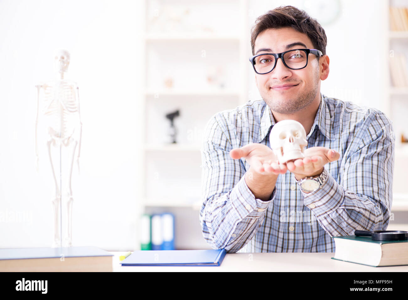Medical student studing the skeleton Stock Photo - Alamy