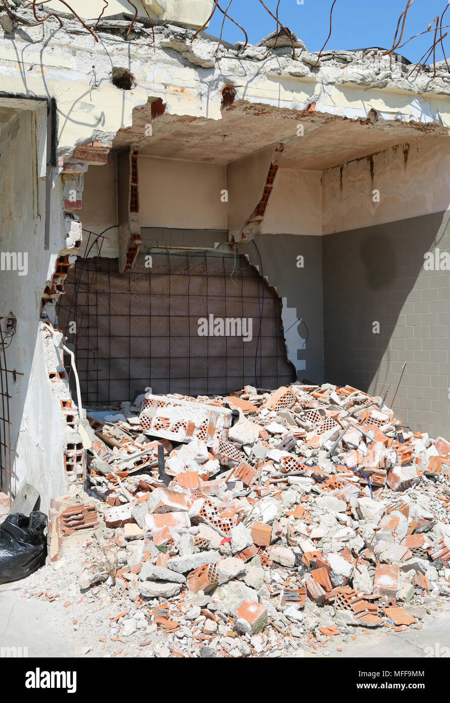 bricks of a completely destroyed wall of the inagible house Stock Photo ...