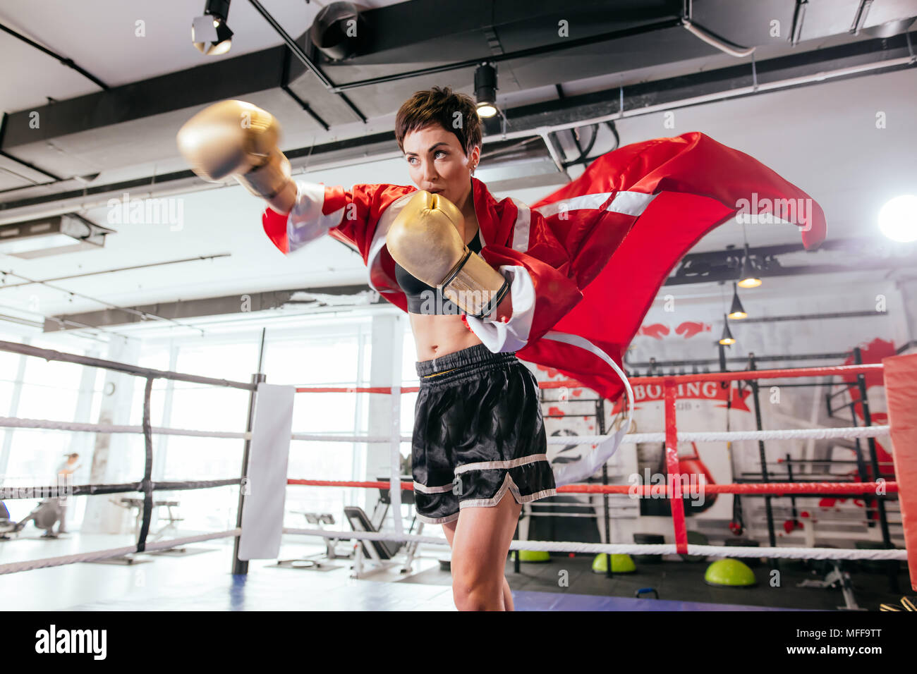 professional female boxer showing master class how to strike enemy on ...