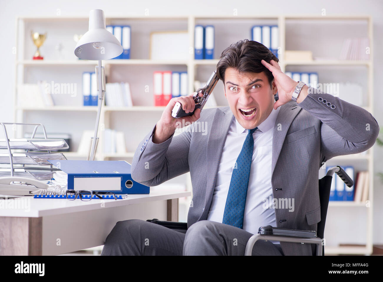 Disabled businessman on wheelchair in disability concept Stock Photo ...