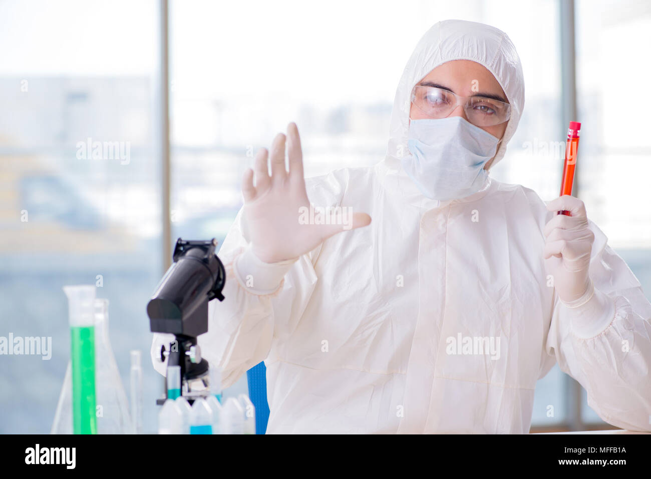 Man doctor checking blood samples in lab Stock Photo - Alamy