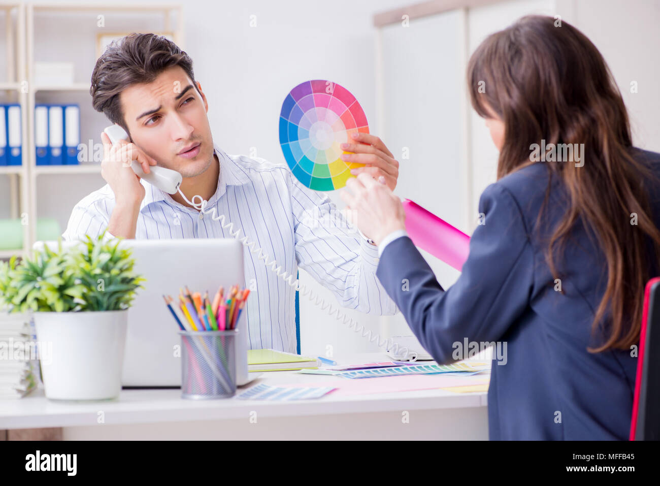 People discussing new design of project Stock Photo - Alamy