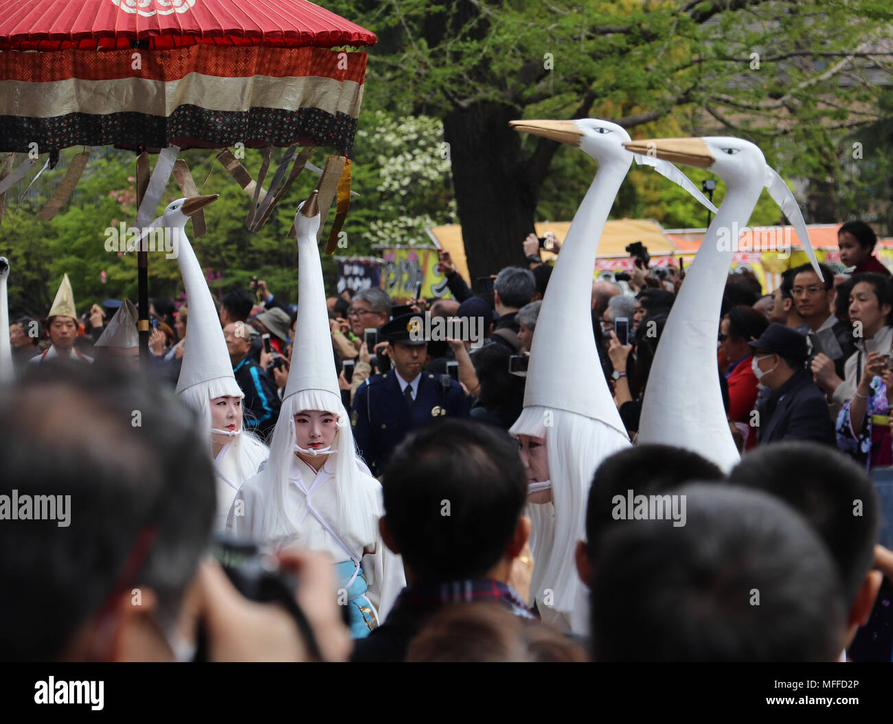 Several dancers dressed in heron costumes perform the White Heron Dance ...