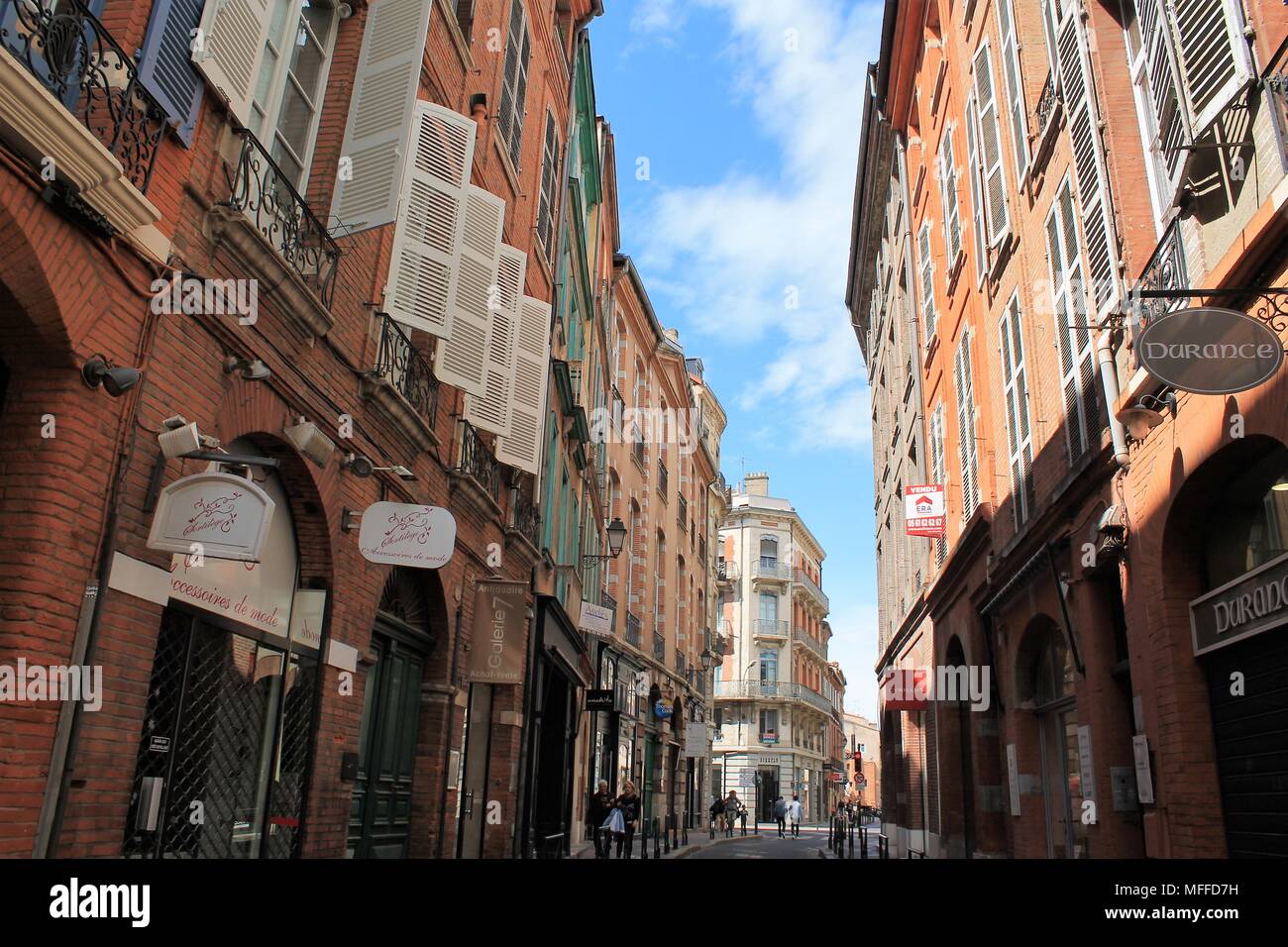 Typical colorful street of Toulouse historic city center, Haute Garonne ...