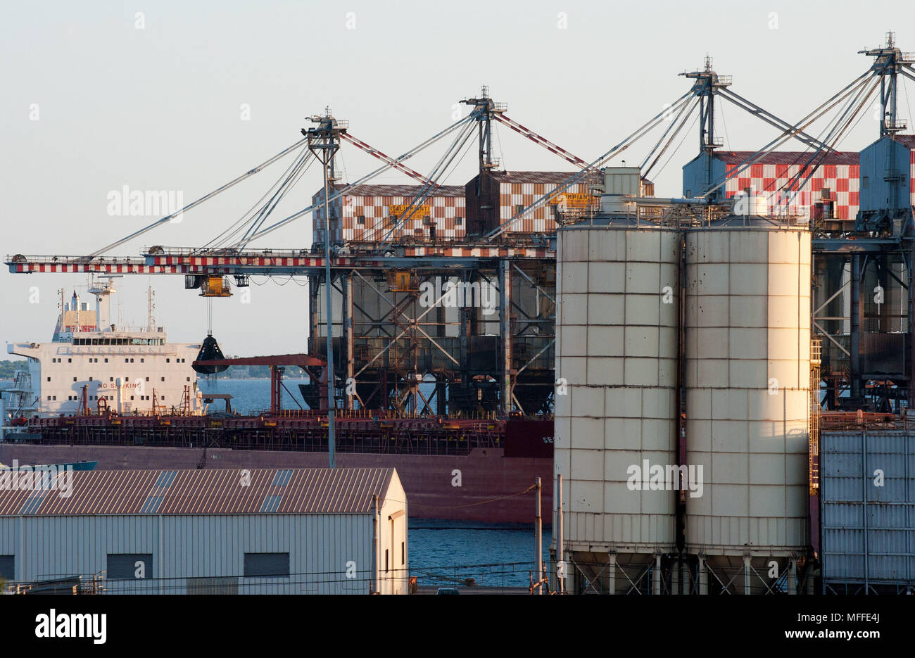 Taranto. ILVA steel factory, transport of minerals on the conveyor belt ...