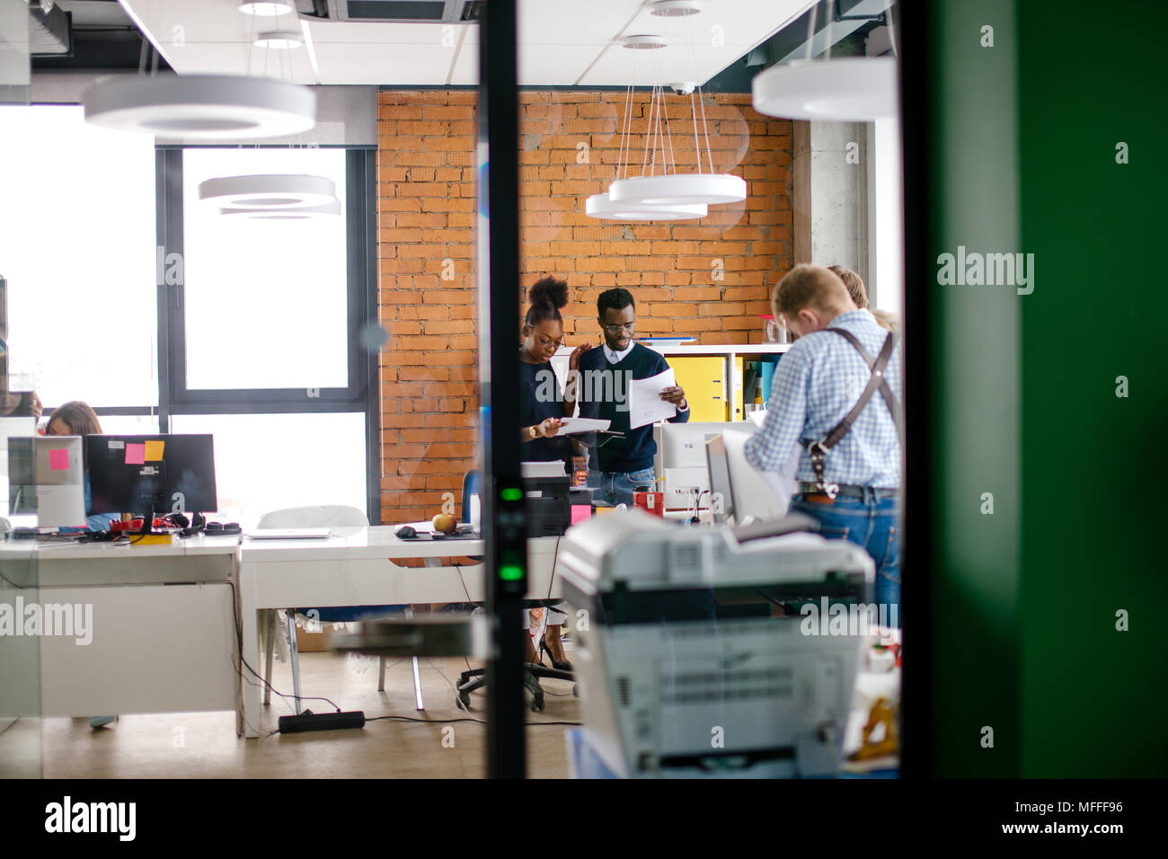 African journalists are reading article of draft version of newspaper ...
