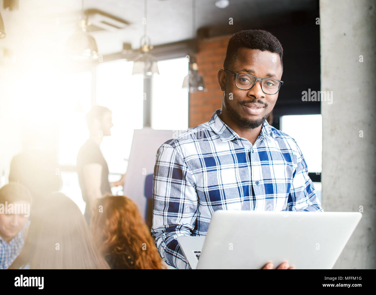 young African guy is testing laptop, install secure system Stock Photo ... young African guy is testing laptop, install secure system Stock Photo ...
