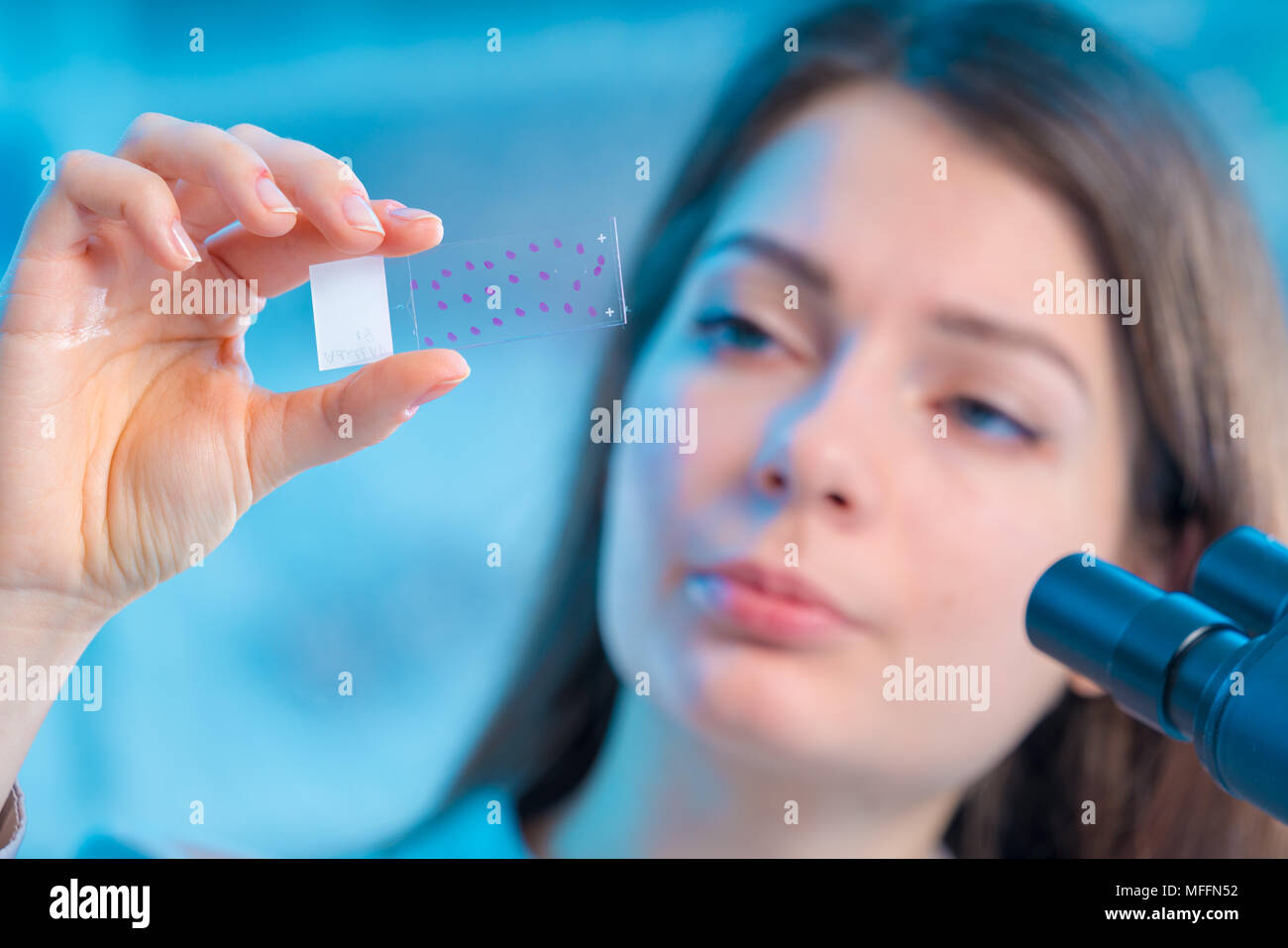 female technician take sample on microscope slide Stock Photo - Alamy