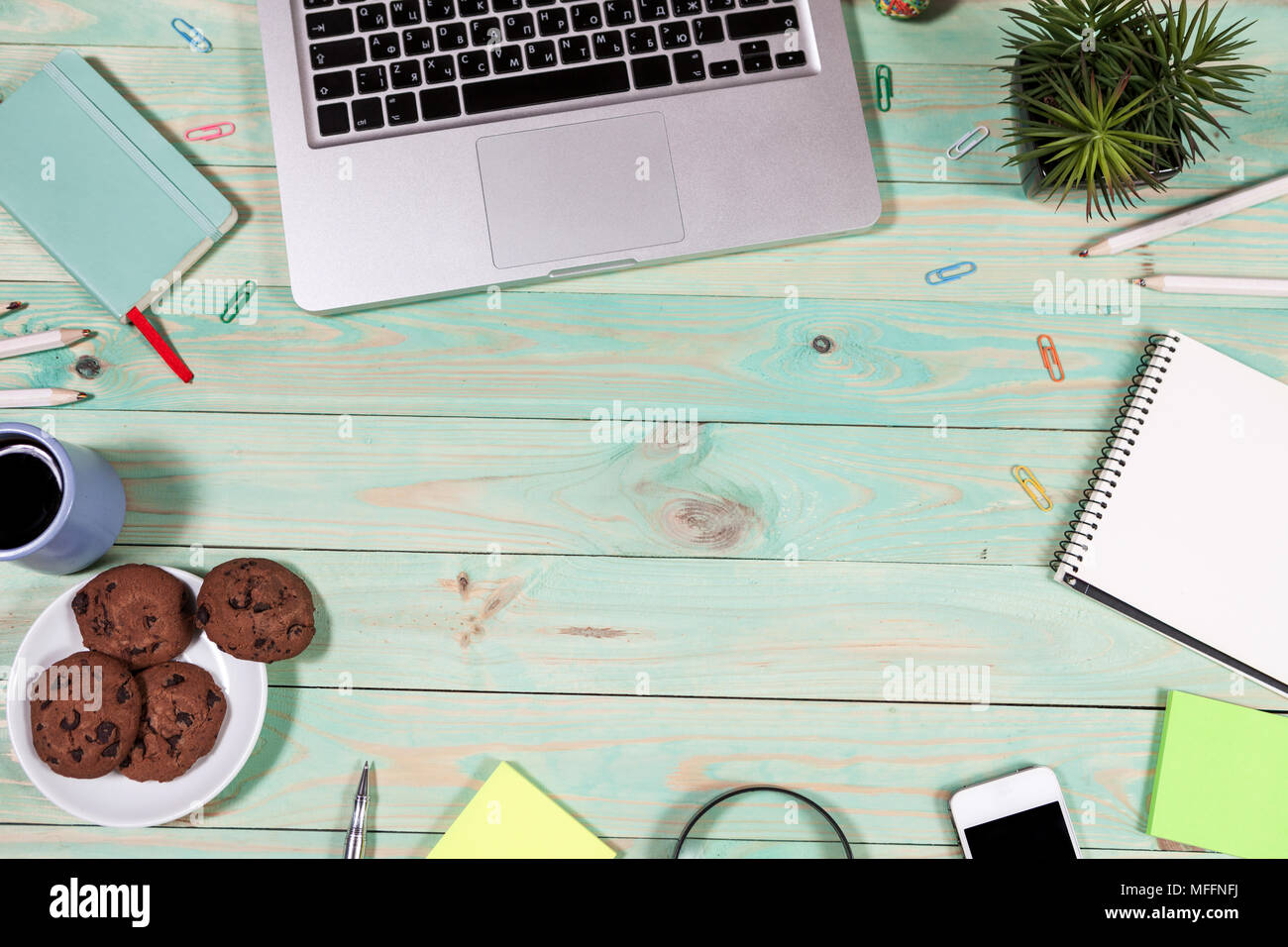 Blue office desk table with with office supplies. Top view with copy ...