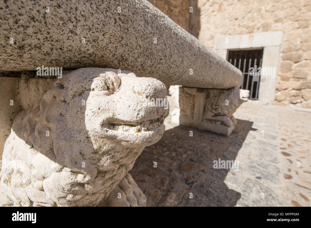 ancient statues of dogs holding granite bench, inside Bisagra Gate ...