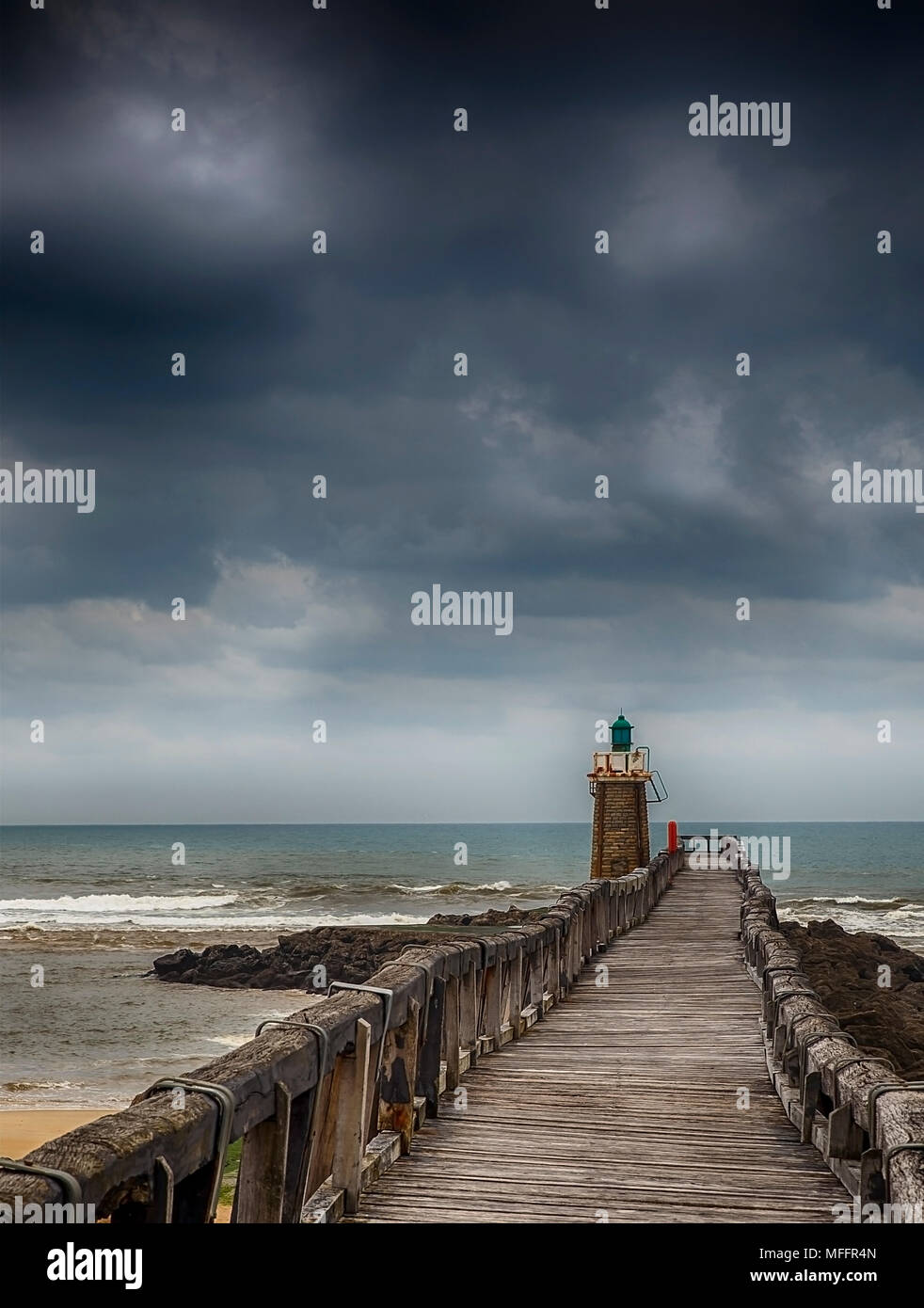 lighthouse waiting for the storm, france Stock Photo - Alamy