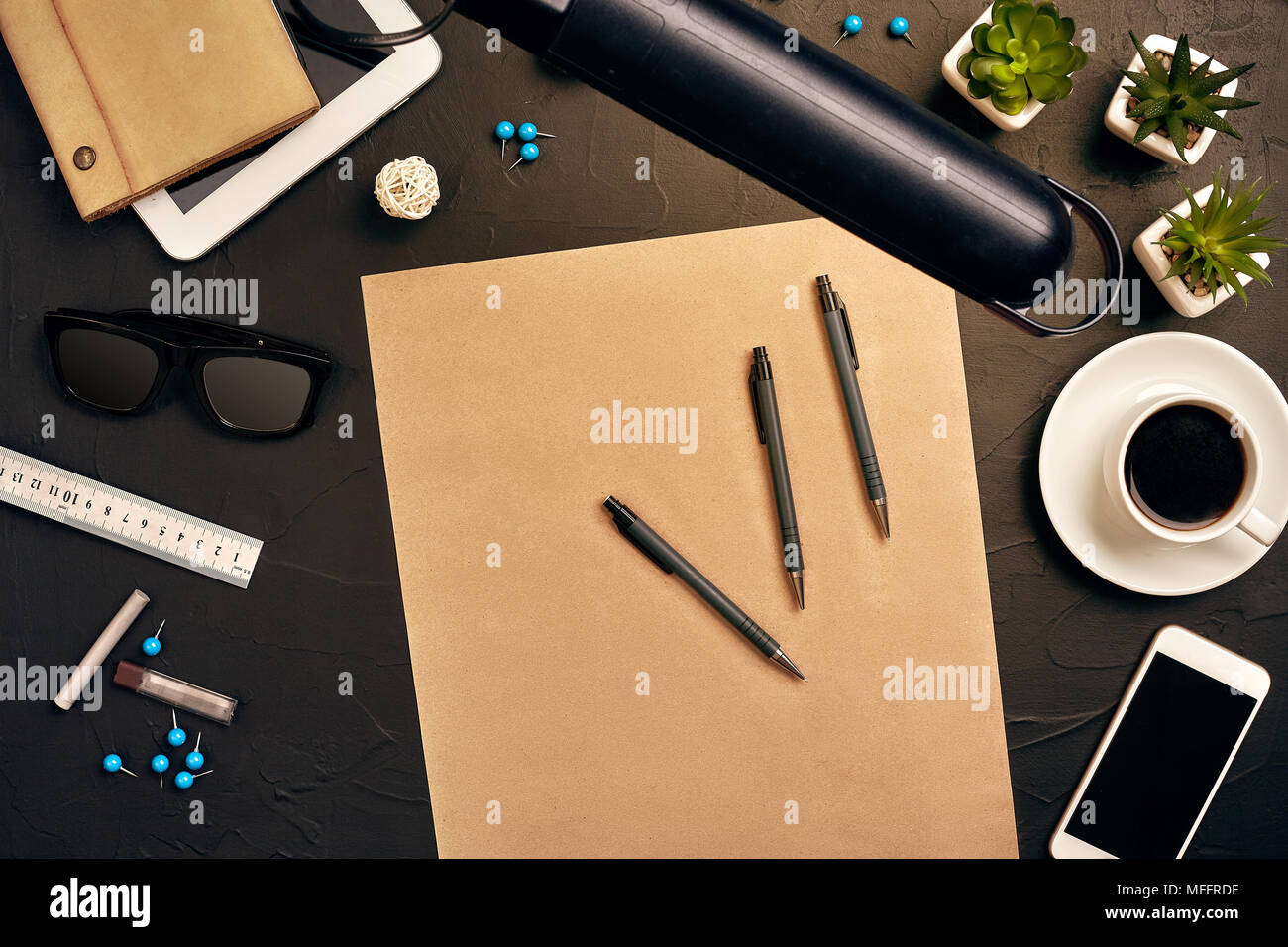 Engineer's desk in office with various gadgets and documents Stock ...