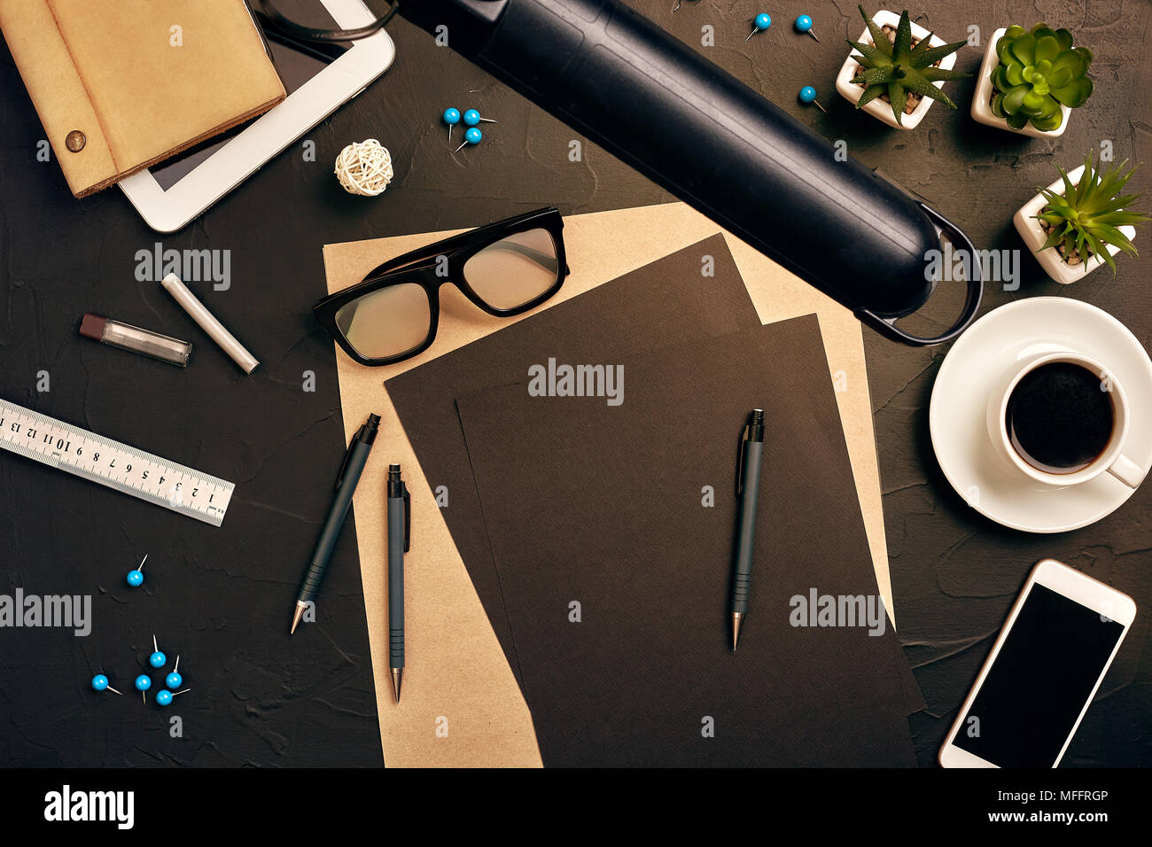 Engineer's desk in office with various gadgets and documents Stock ...