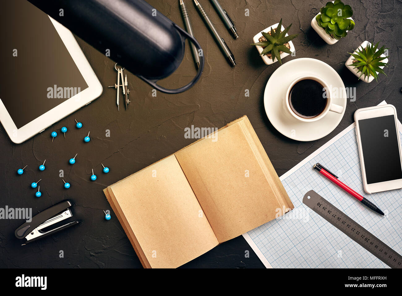 Engineer's desk in office with various gadgets and documents Stock ...