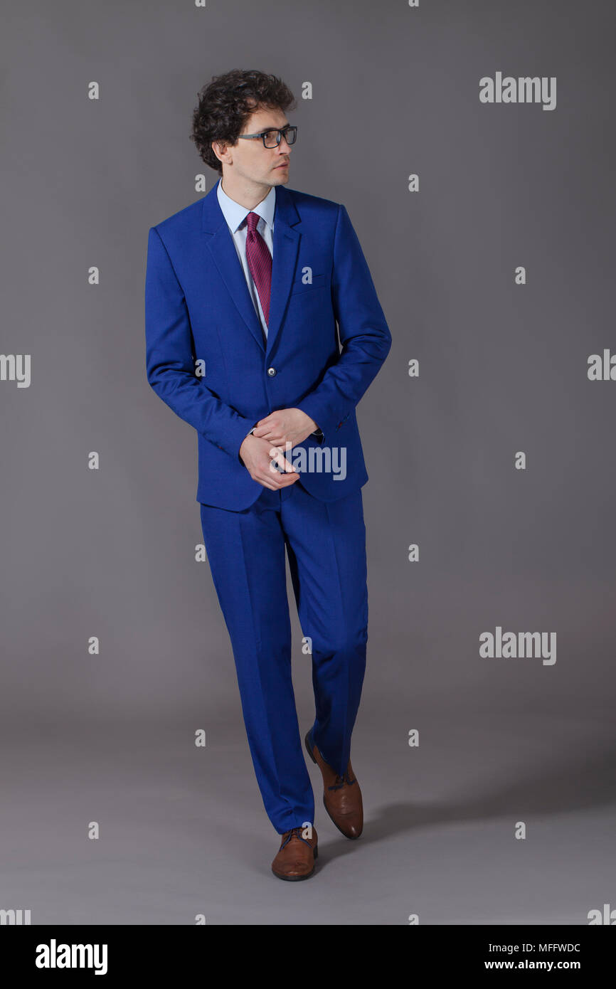 Intellectual man looking left making step Stock Photo - Alamy