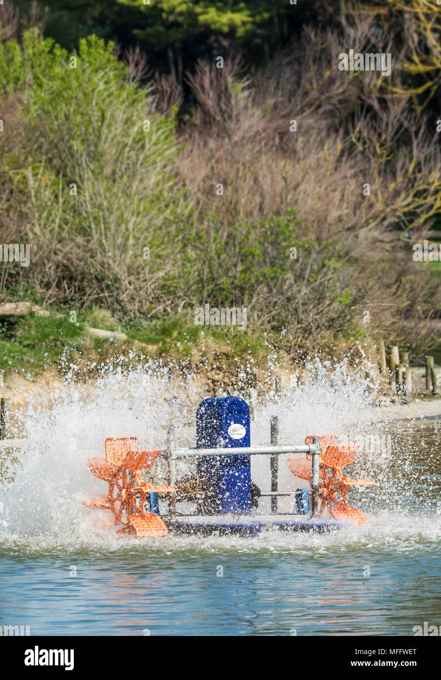 Water aerator in a small lake Stock Photo - Alamy