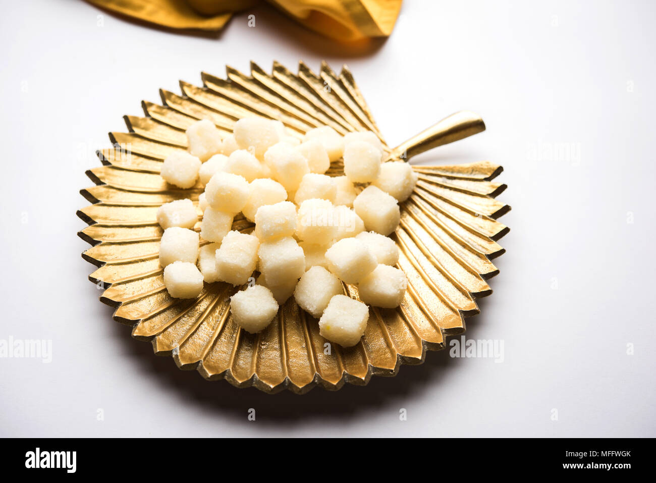Bengali Sweet Chena Murki served in a golden plate, selective focus ...