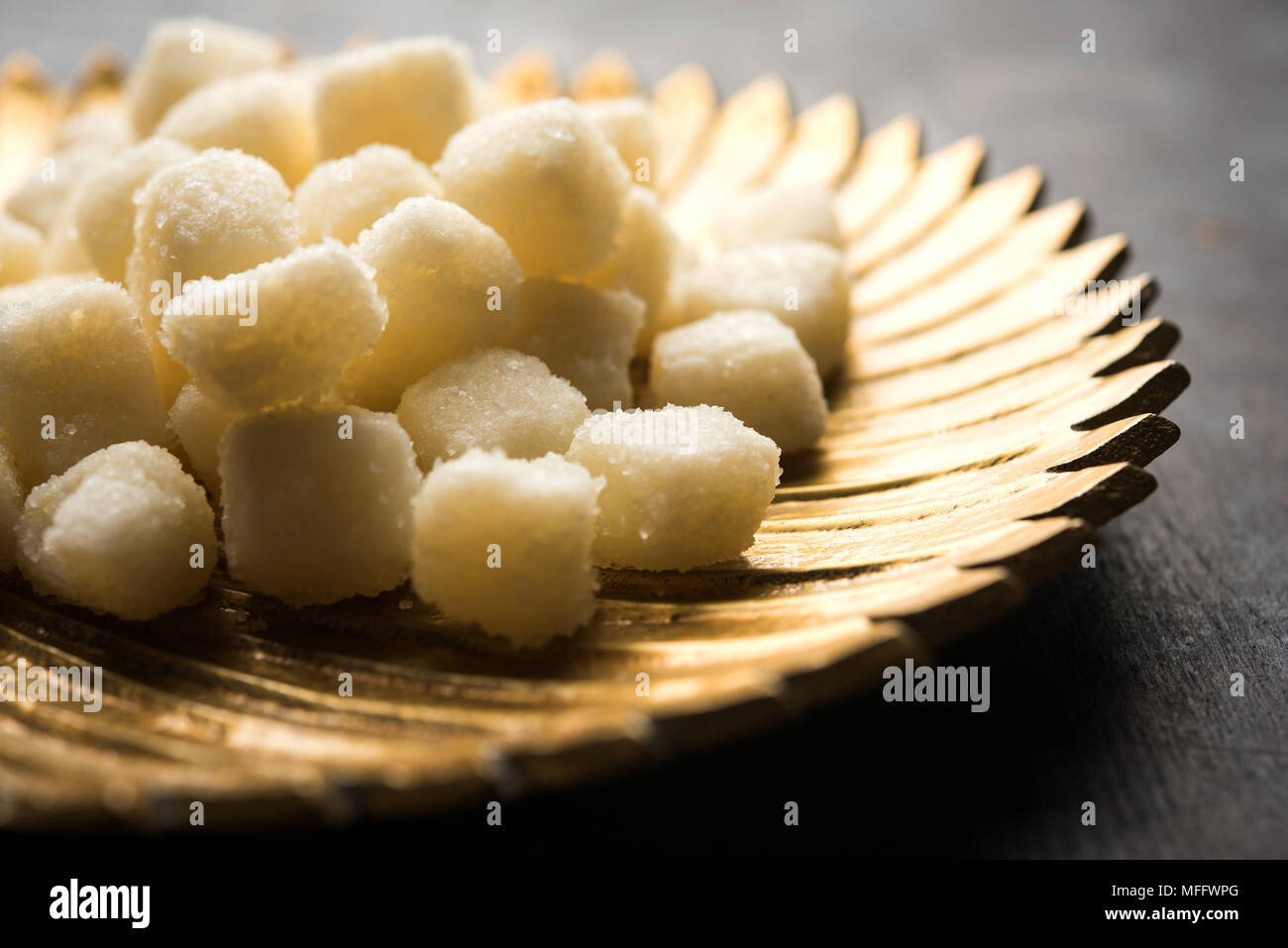 Bengali Sweet Chena Murki served in a golden plate, selective focus ...