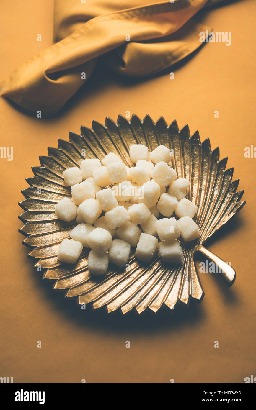 Bengali Sweet Chena Murki served in a golden plate, selective focus ...